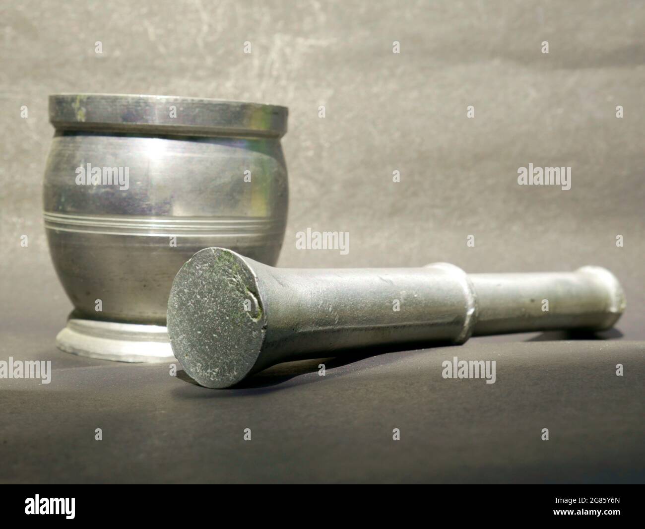 Asian Silver metal food spice hand crusher isolate at black background ...