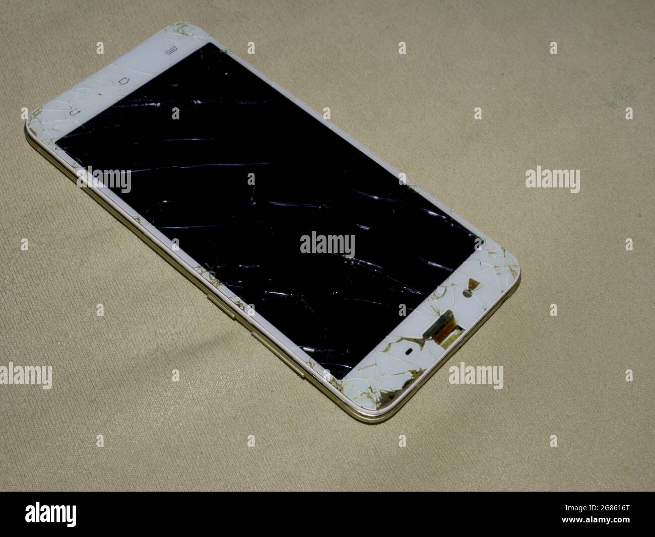 Spoiled Mobile phone isolate on white surface, Technology object image ...