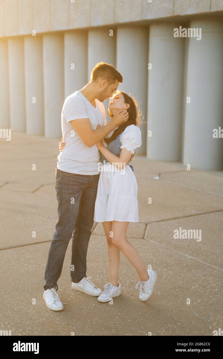 Vertical full length portrait of beautiful romantic young couple in ...