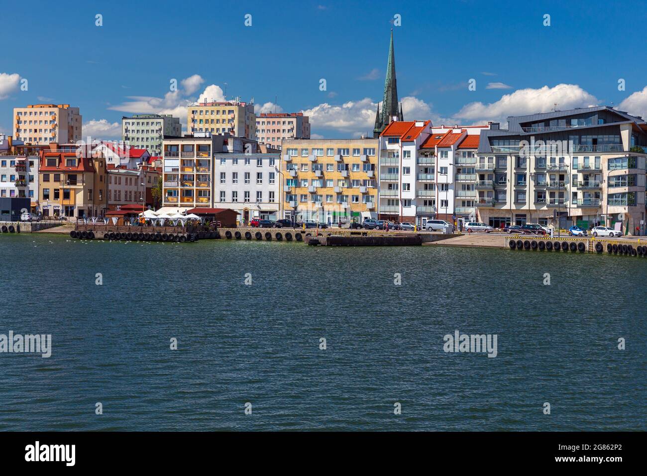 The bay and houses on the city embankment on a sunny day. Swinoujscie ...