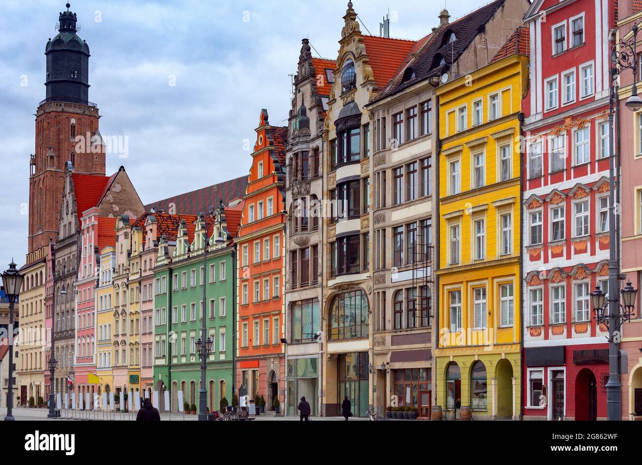 Multi-colored facades of medieval houses on the town hall square ...