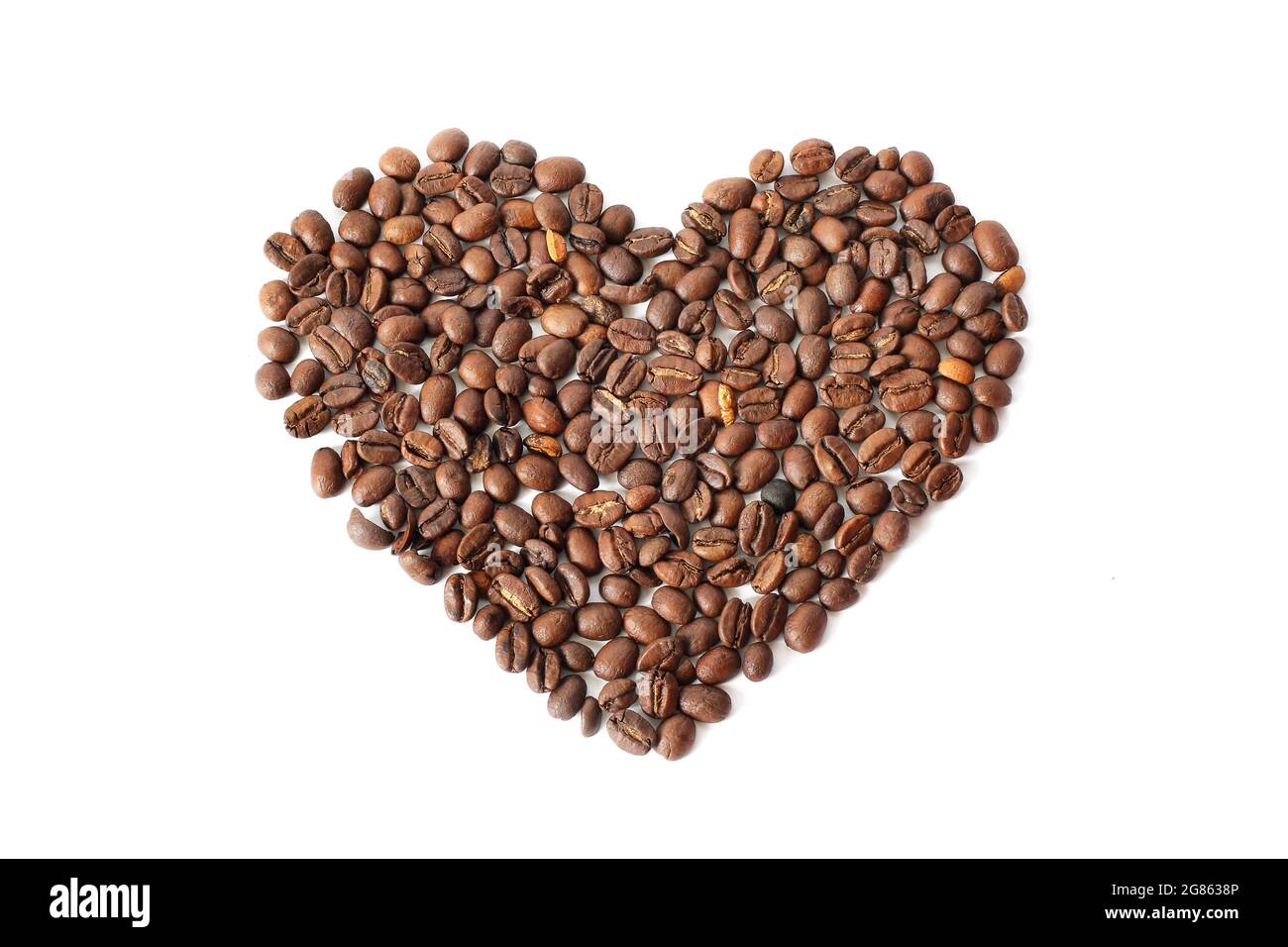Coffee beans. Heart made from coffee beans on a white background. brown ...