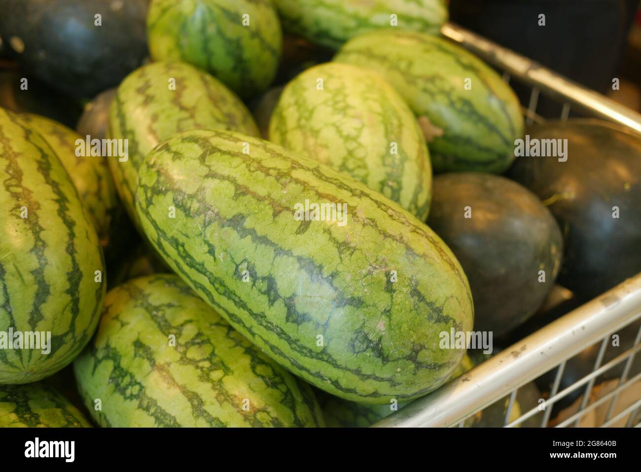 close up of water melon display for sale at local store Stock Photo - Alamy