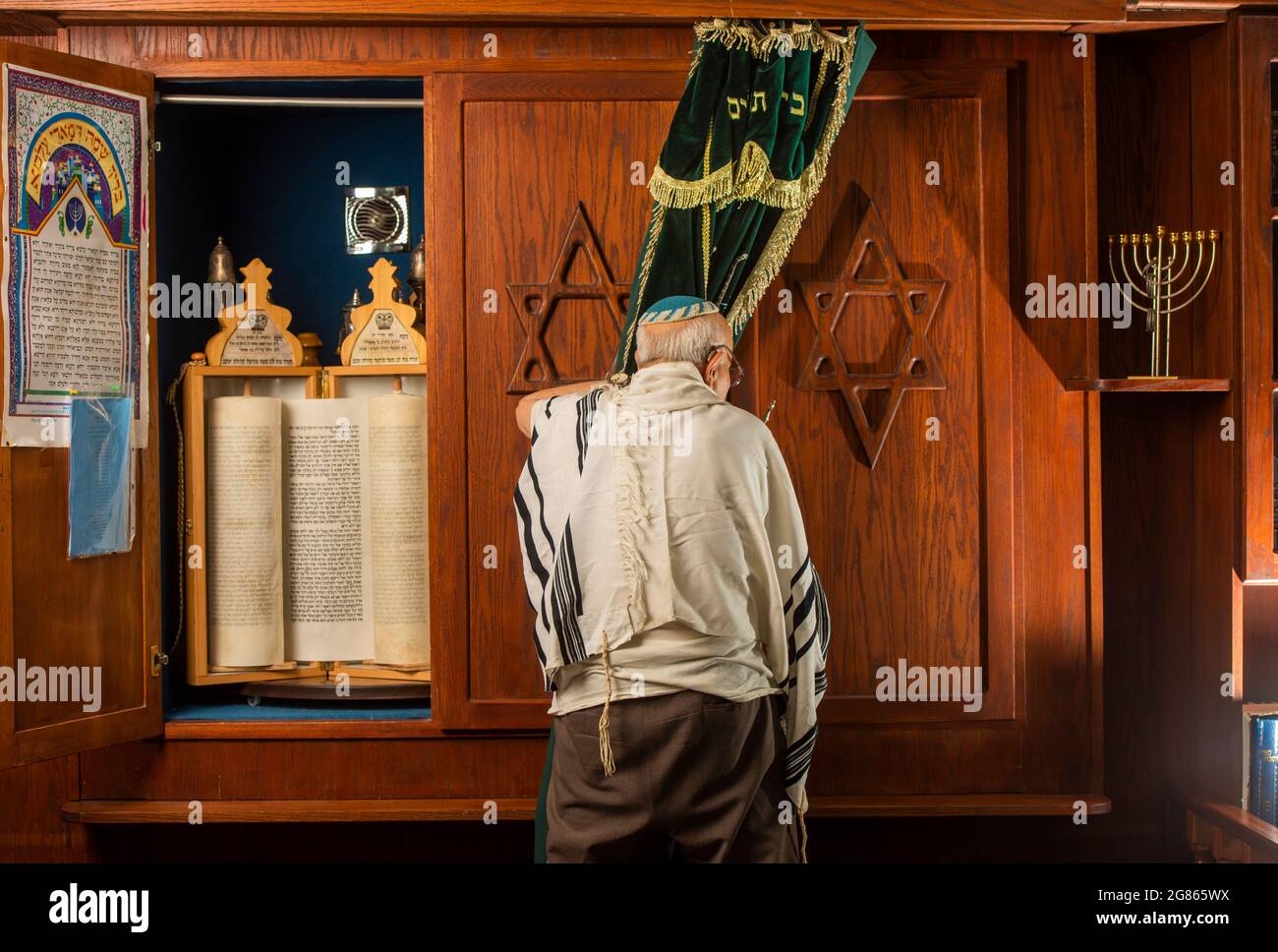 an old man in a synagogue by ttorah scrolls Stock Photo - Alamy