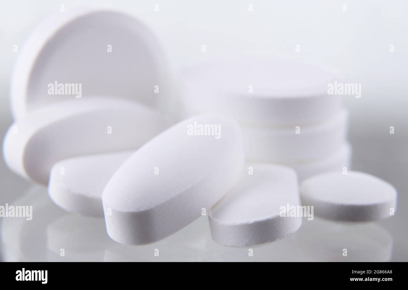 Composition with pharmaceutical drug pills over white background Stock ...