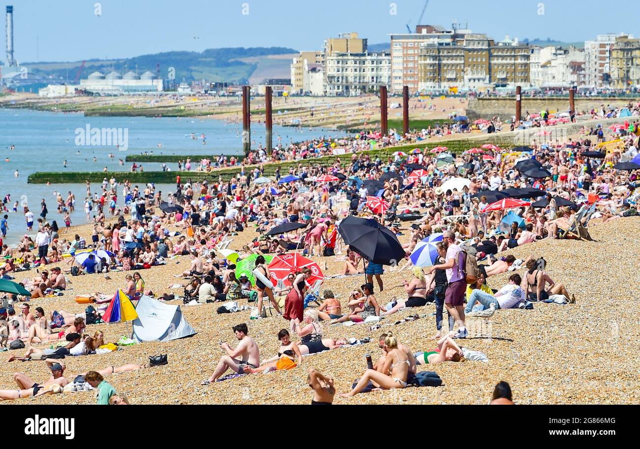 Brighton UK 17th July 2021 - Crowds enjoy hot sunny weather on Brighton ...