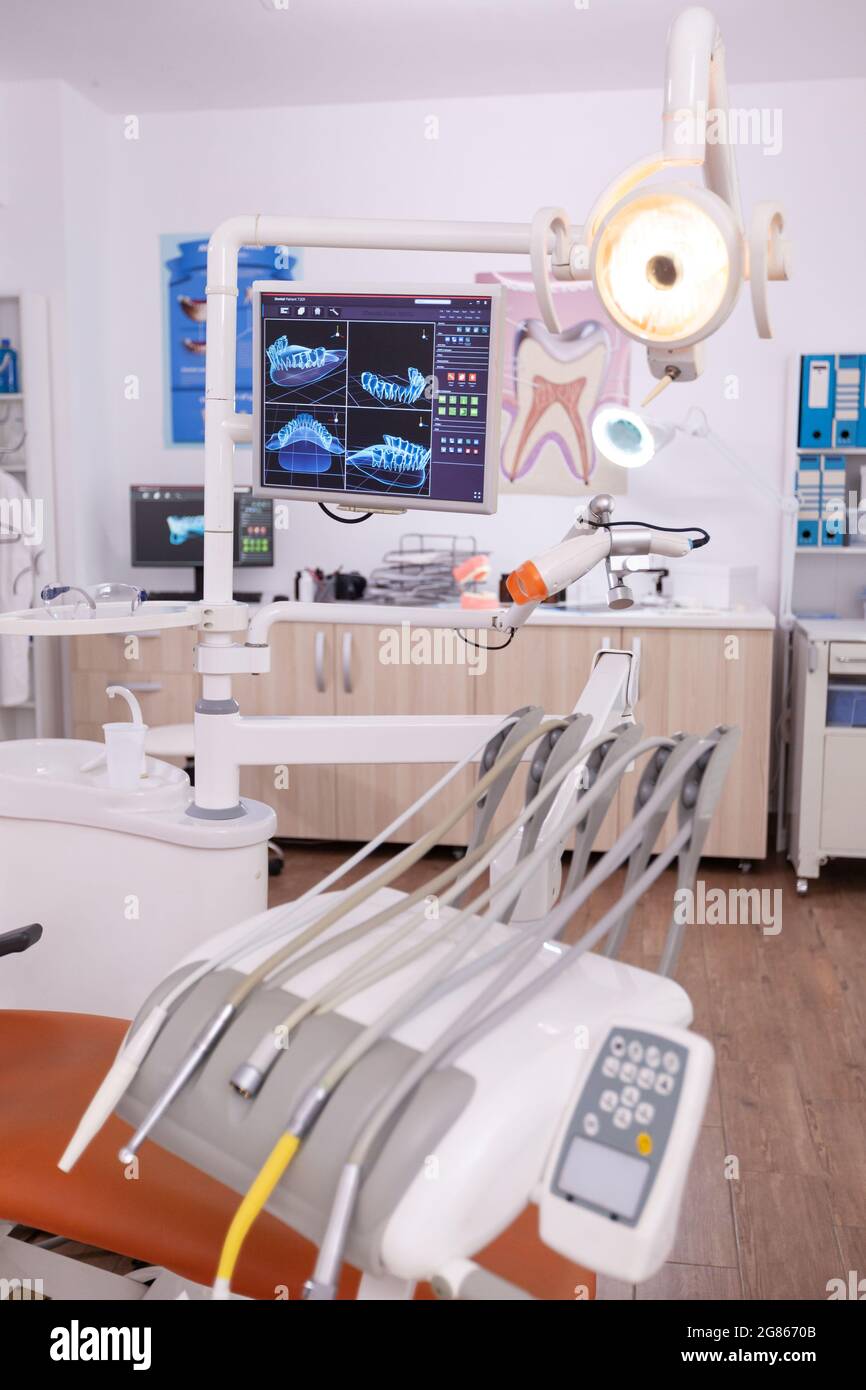 Stomatology dental medical chair with nobody in it equipped with ...