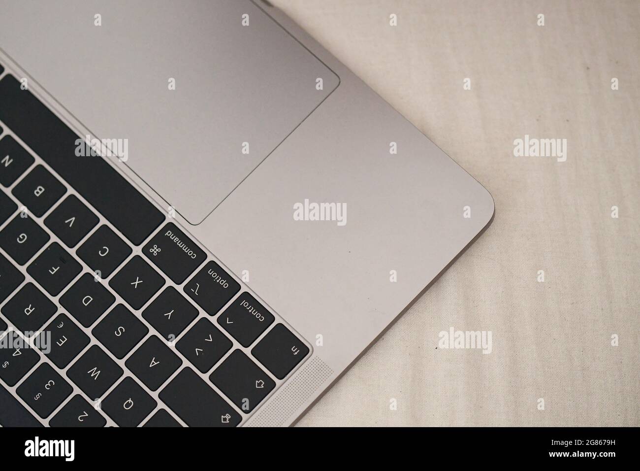 Overhead of a laptop computer in bed Stock Photo - Alamy