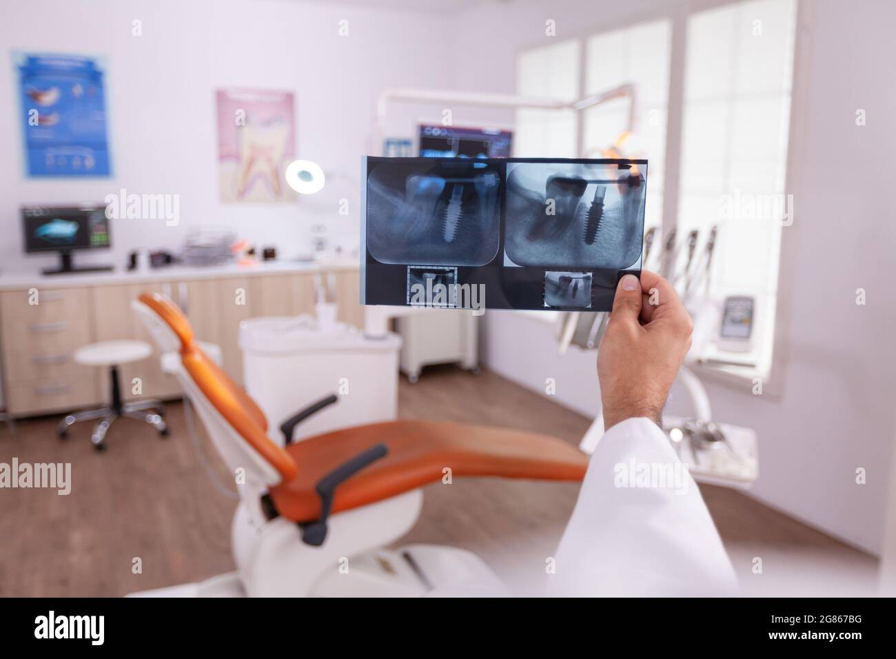 Orthodontist doctor holding medical teeth jaw radiography examining ...