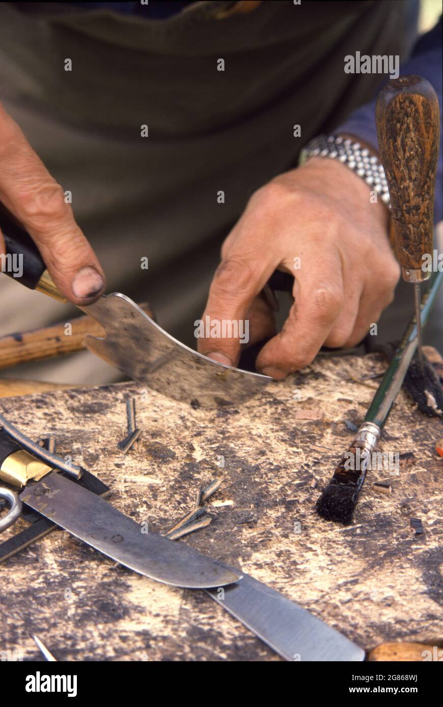 Handwork cutting leather and working with old tools Stock Photo - Alamy