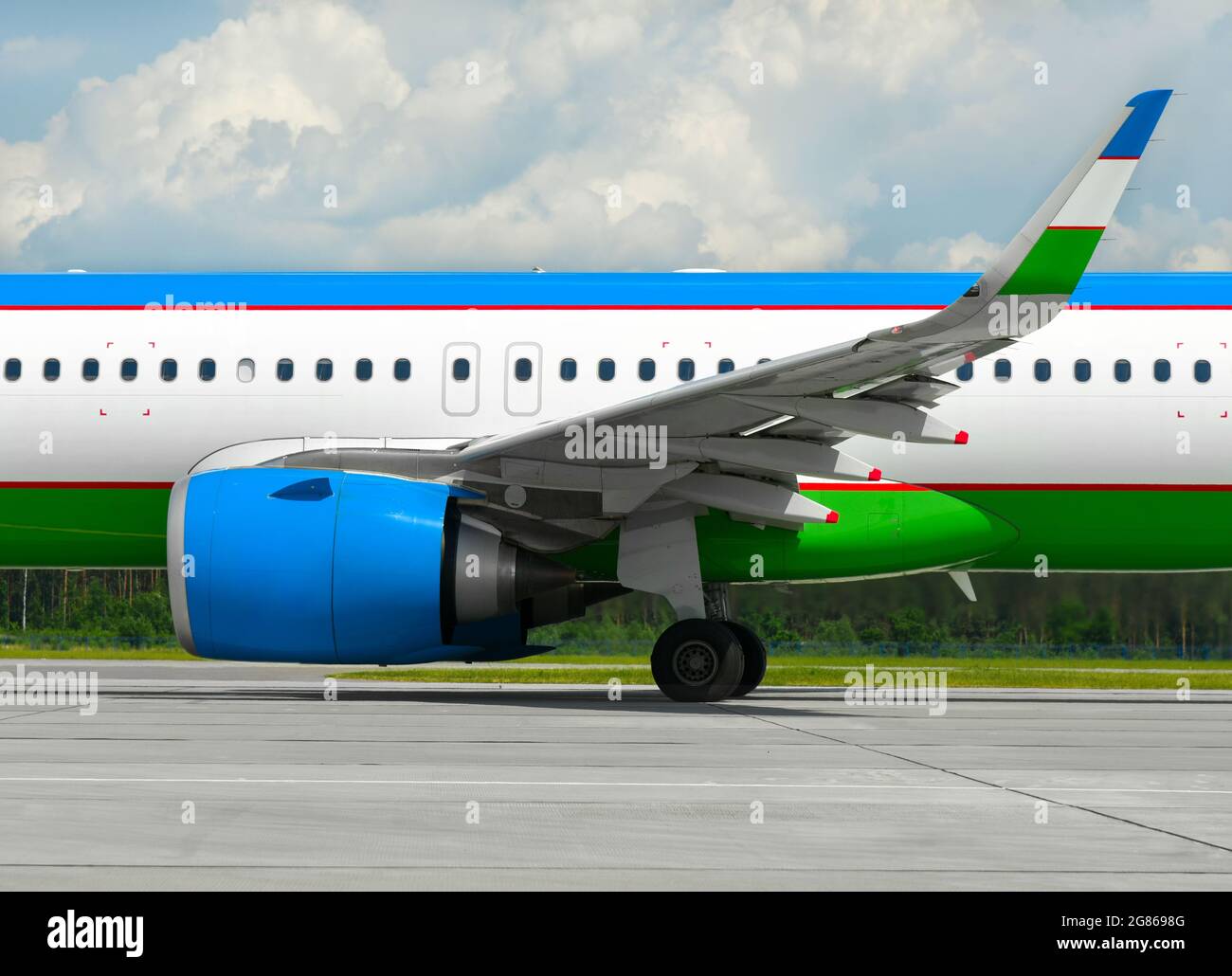 Side view of the engine of a modern airplane at the airport Stock Photo ...