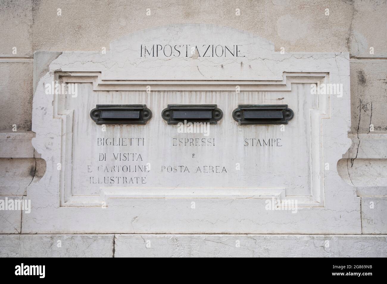 Mantua, Italy. July 13, 2021. Ancient boxes for mail on a muronel city ...