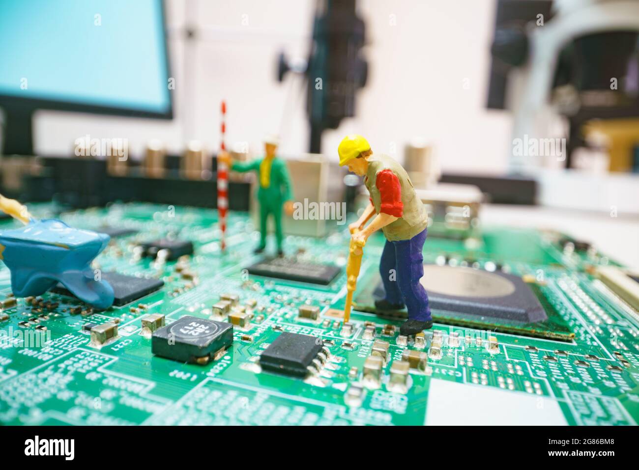 Miniature repair man on mainboard, Miniature figure of worker team try ...