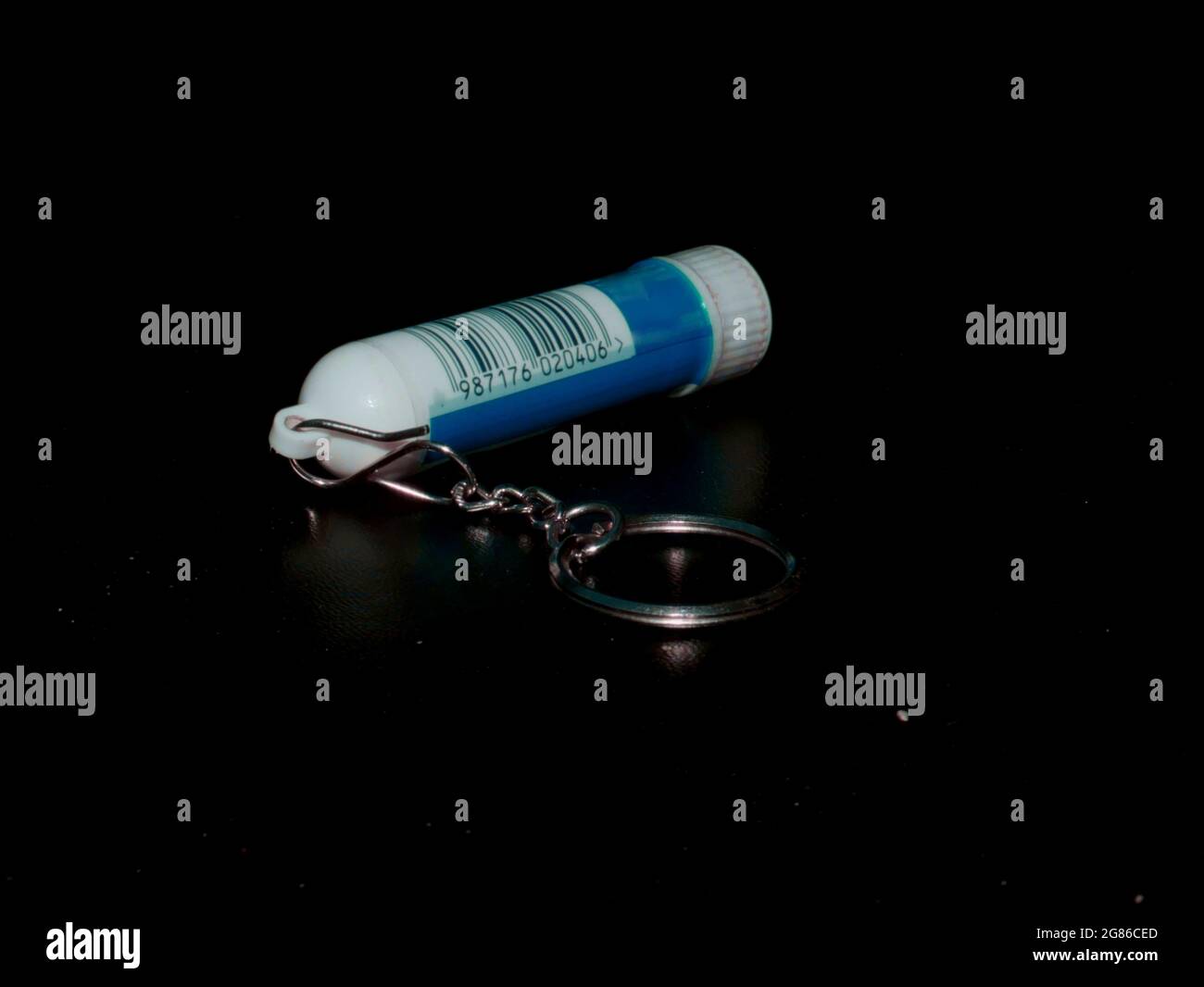 Medicated inhaler key chain presented on dark background Stock Photo ...