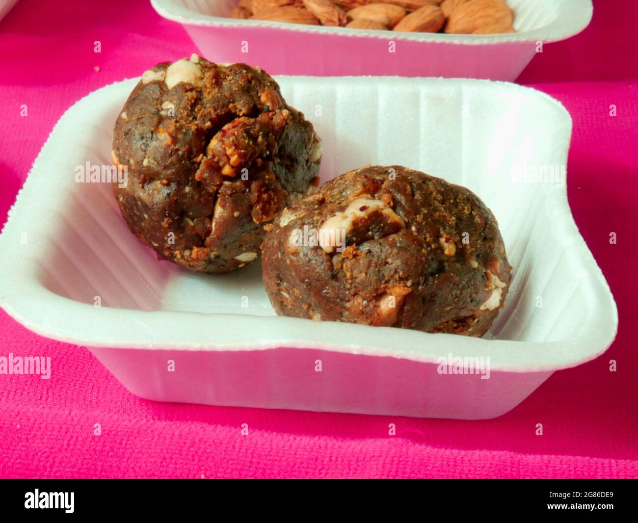 jaggery sweets kept on white disposal plate, Traditional food image ...