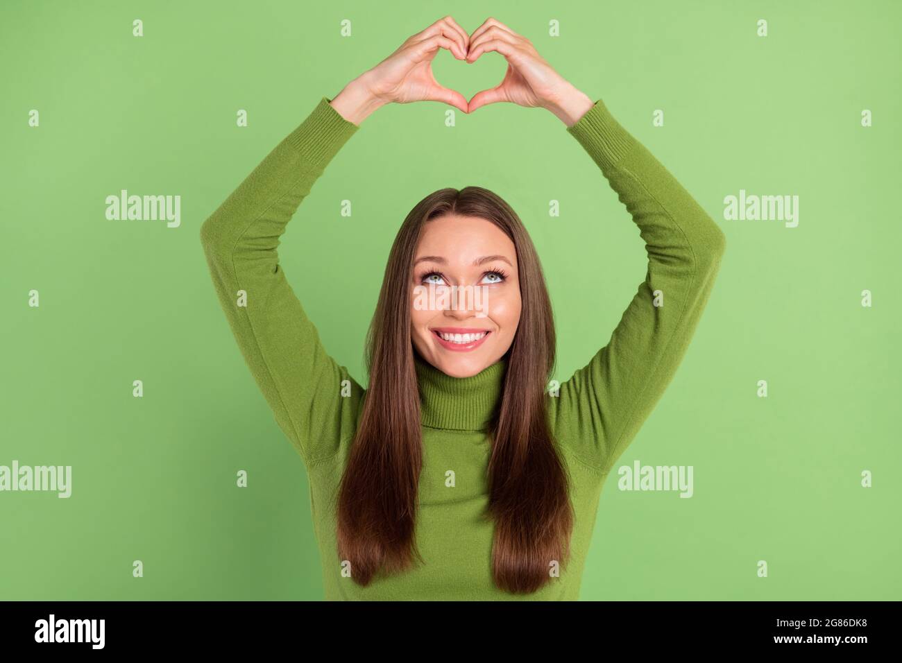 Photo portrait happy woman showing heart sign with fingers over head ...