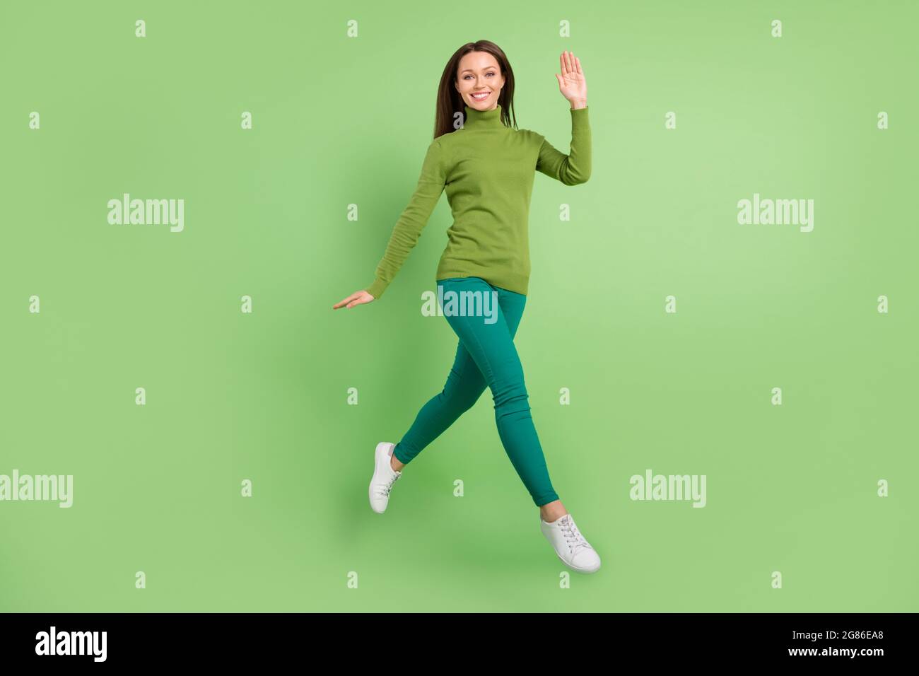 Full length body size photo woman jumping up waving hand smiling ...