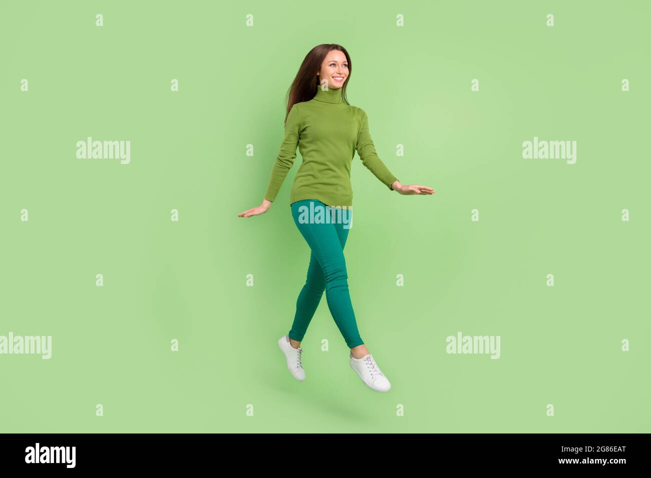 Full body photo of happy young nice lady jump up go empty space smile ...