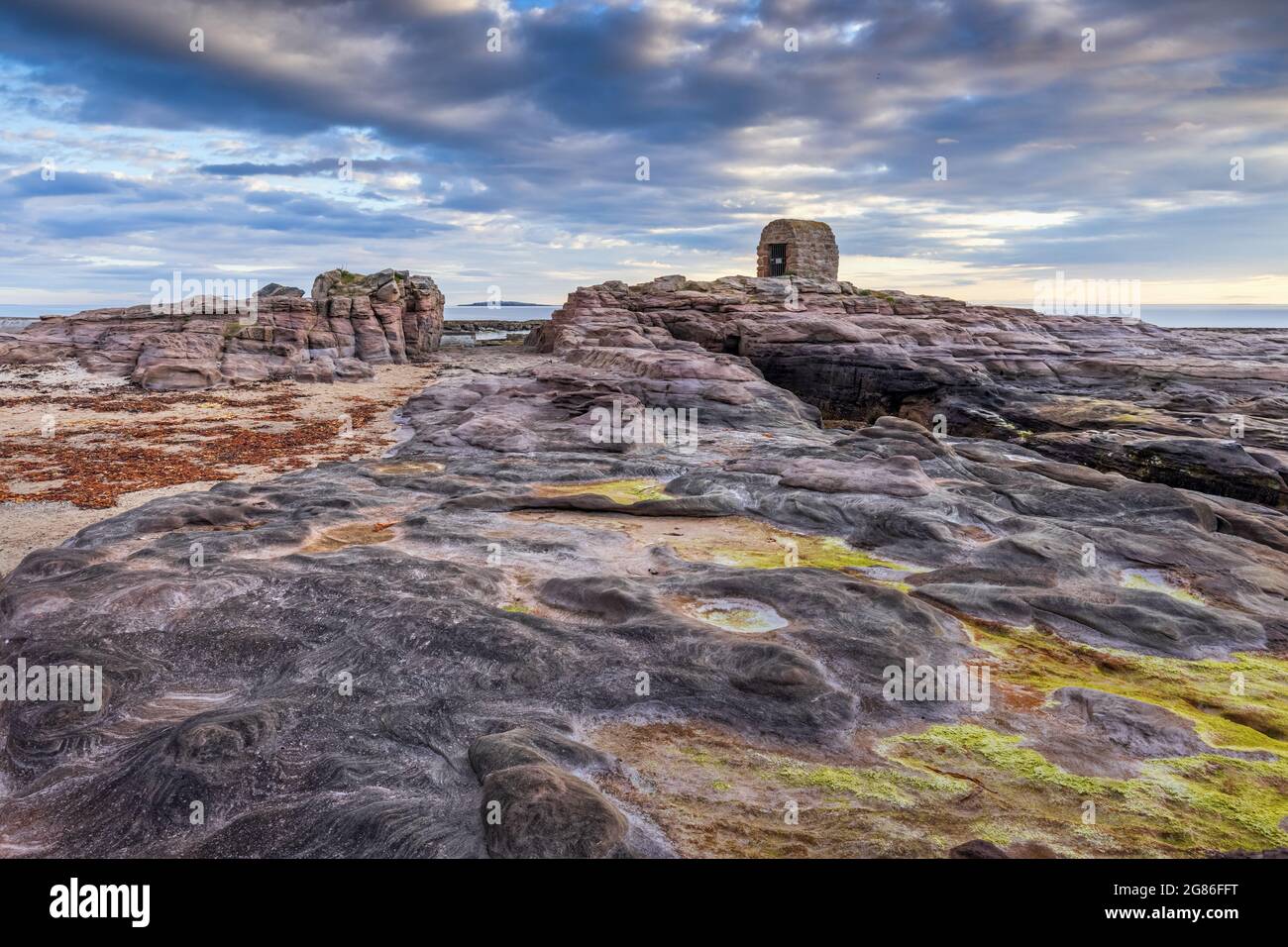 The Powder House at Seahouses on the Northumberland coast, with a ...