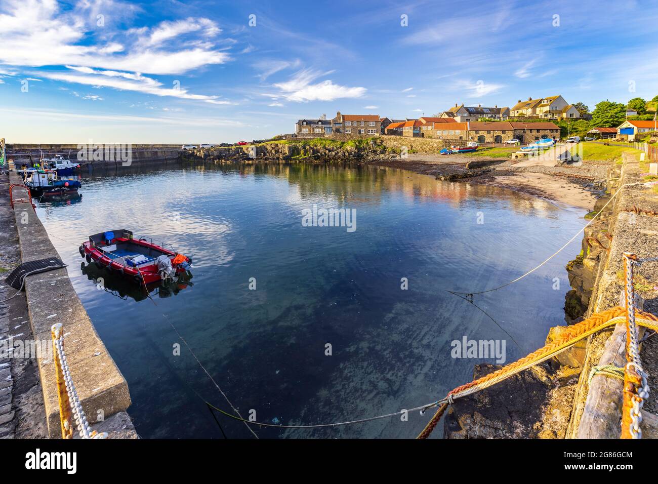 The small fishing village of Craster, with its picturesque harbour, on ...