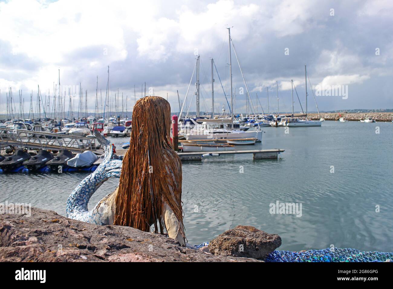 Brixham Marina and mermaid statue, Devon Stock Photo - Alamy