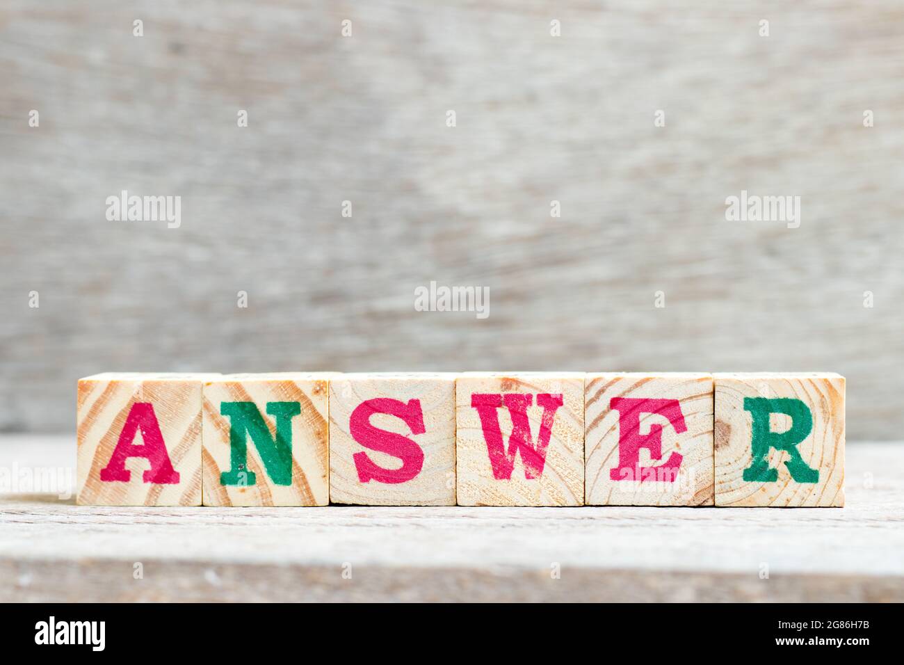 Letter block in word answer on wood background Stock Photo - Alamy