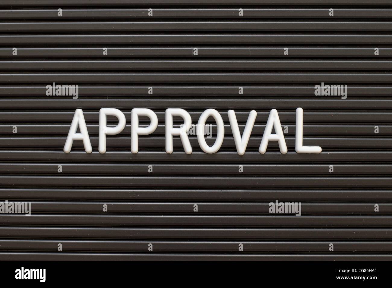 Black color felt letter board with white alphabet in word approval ...