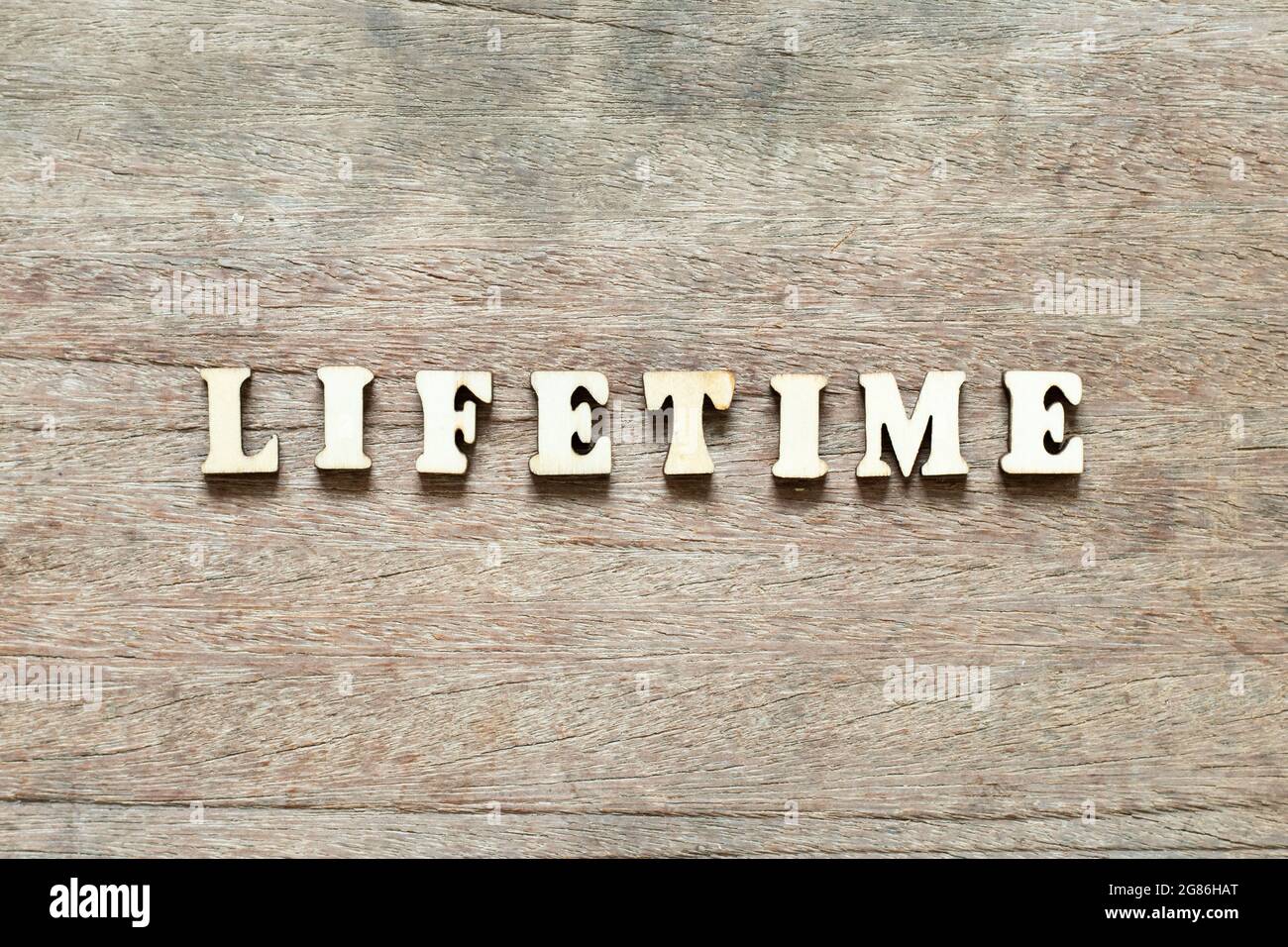 Letter block in word life time on wood background Stock Photo - Alamy