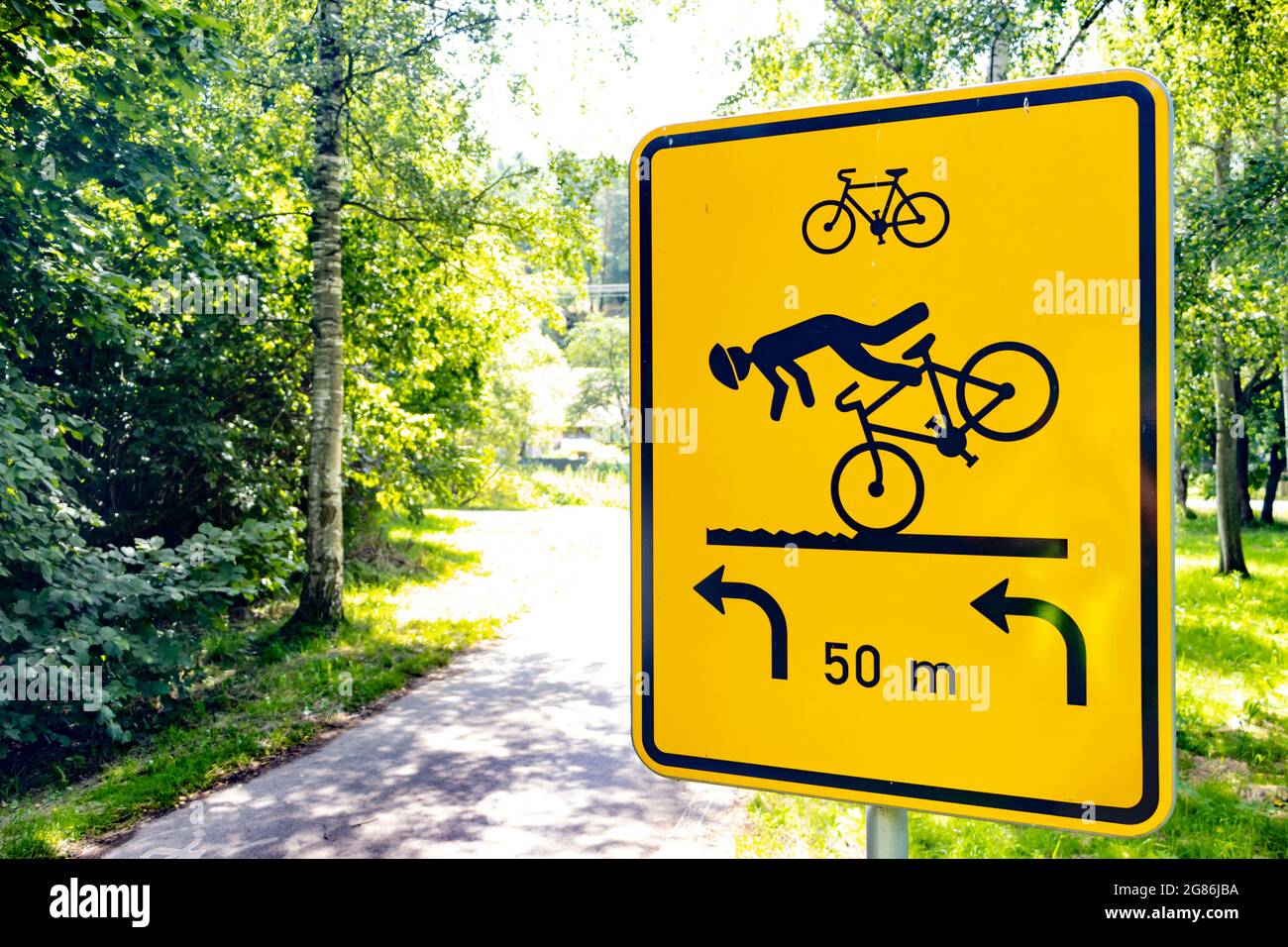 Road sign by the way with warning information for cyclists about the ...