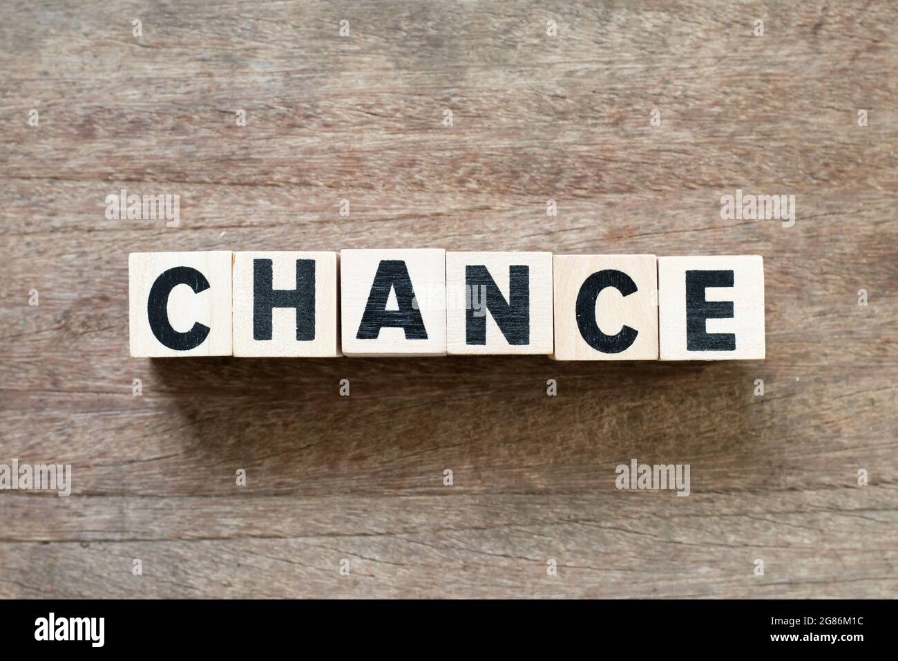 Letter block in word chance on wood background Stock Photo - Alamy