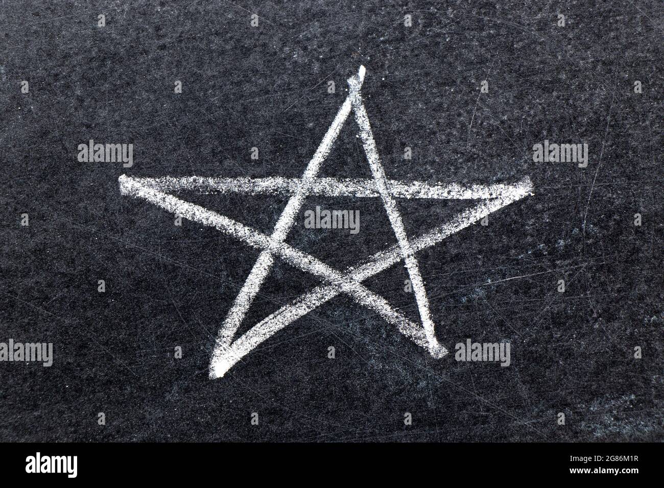 White chalk hand drawing in star shape on black board background Stock ...