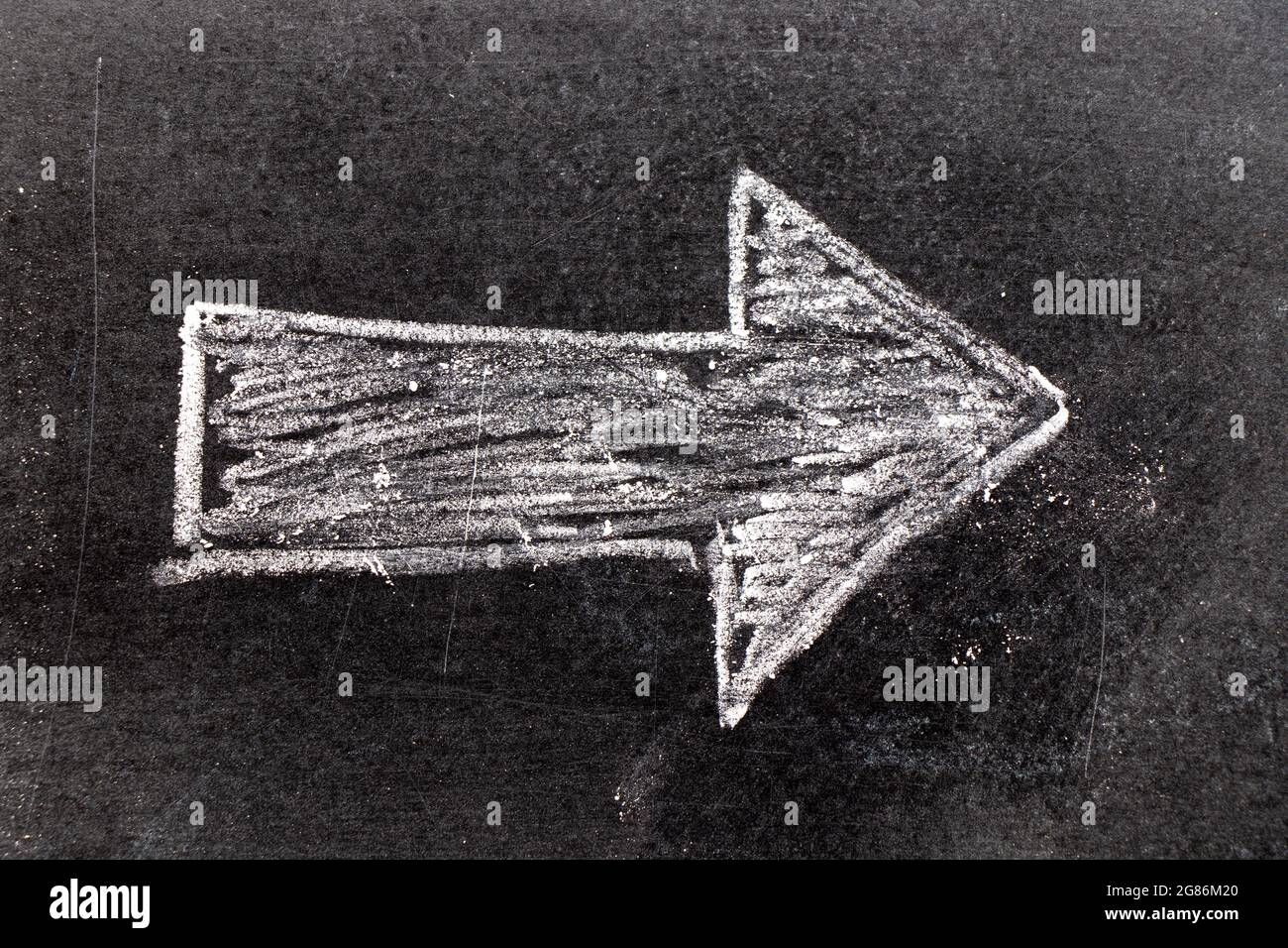 White chalk hand drawing in arrow shape on black board background Stock ...
