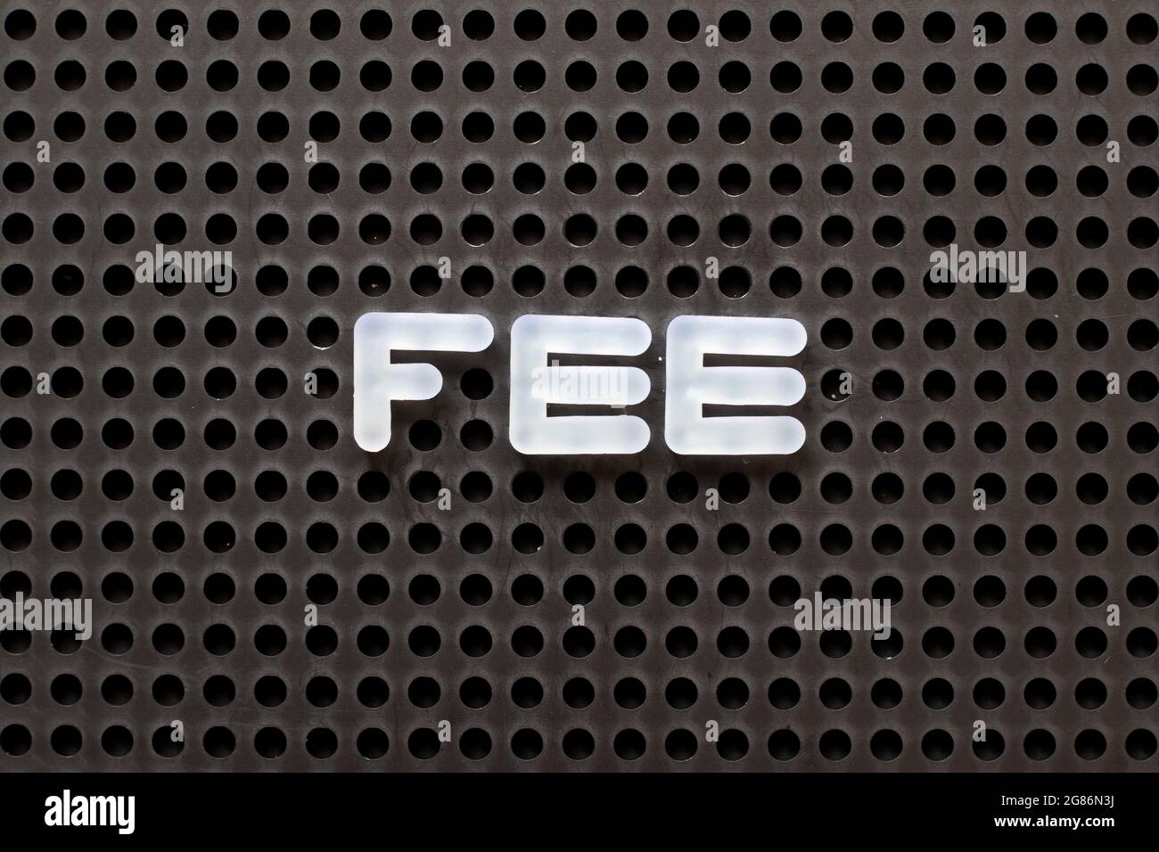 Black color pegboard with white letter in word fee Stock Photo - Alamy