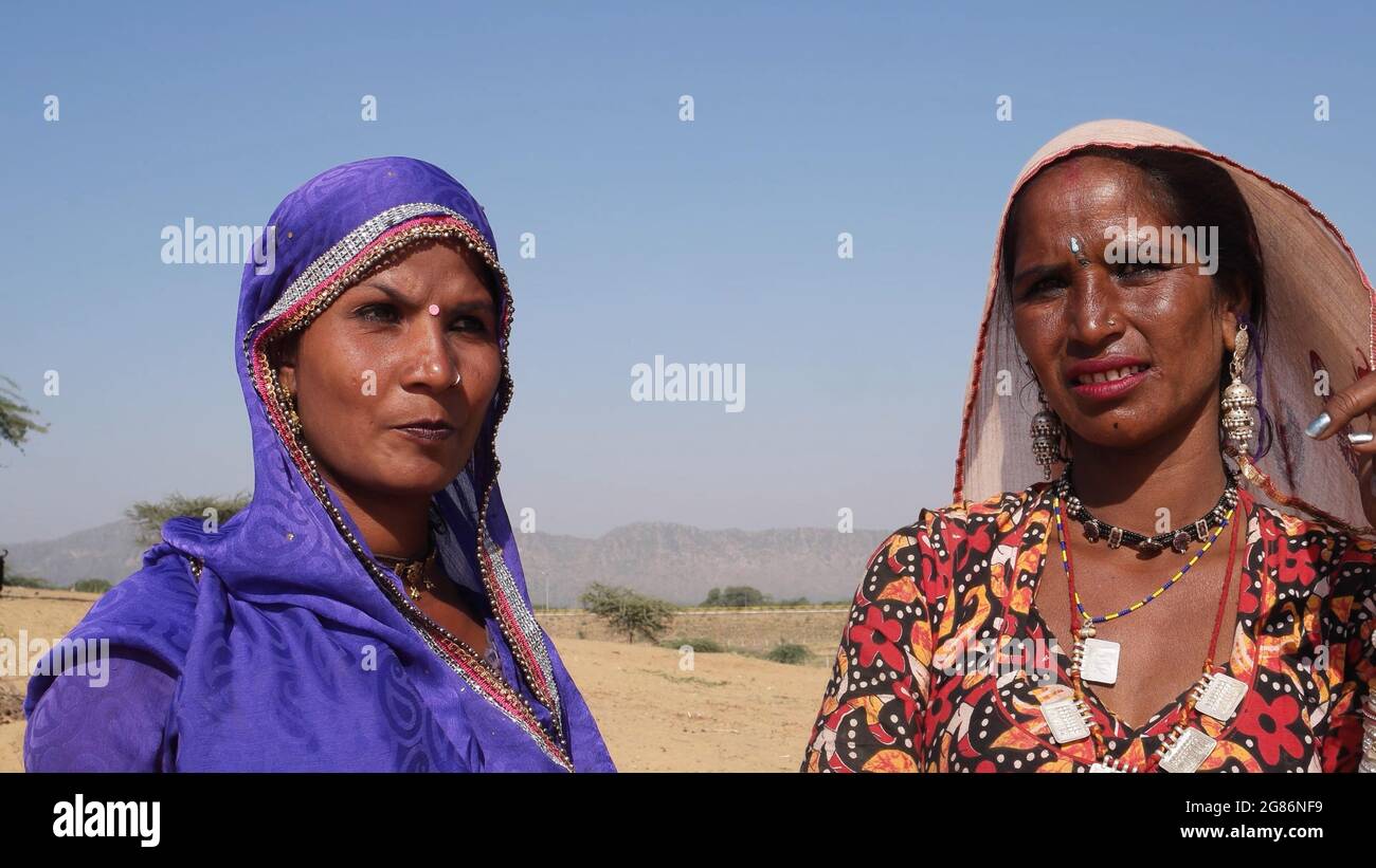 Closeup shot of two South Asian women wearing traditional costumes ...