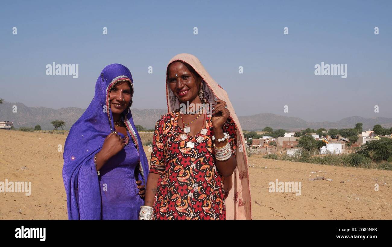 Closeup shot of two South Asian women wearing traditional costumes ...