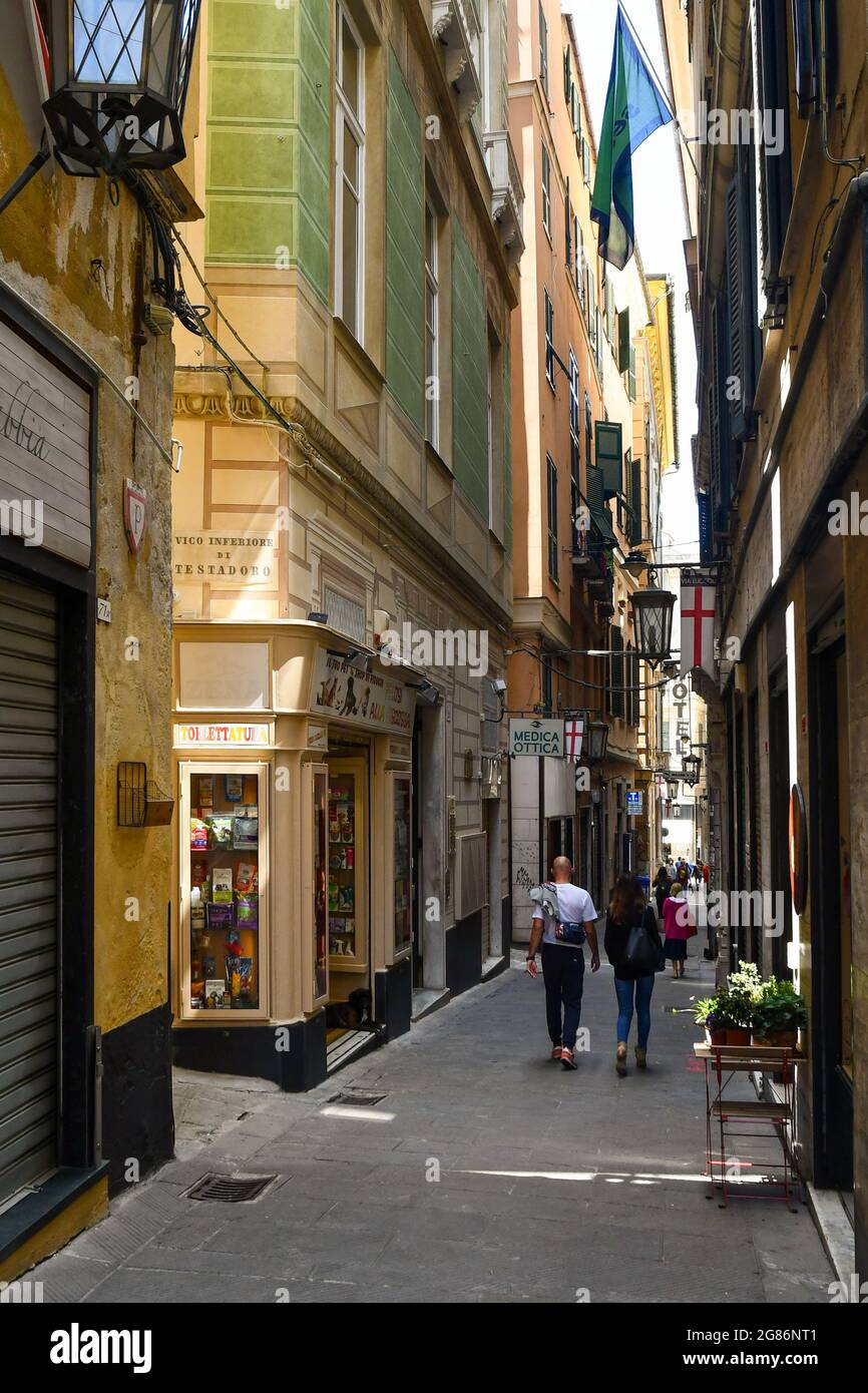 People walking in Via Luccoli, a narrow alley (caruggio) in the ...