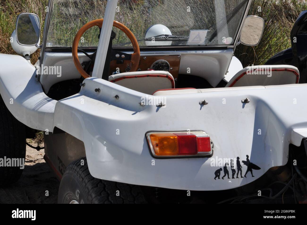 OLBIA, ITALY - Aug 23, 2016: A white convertible beach car with a ...