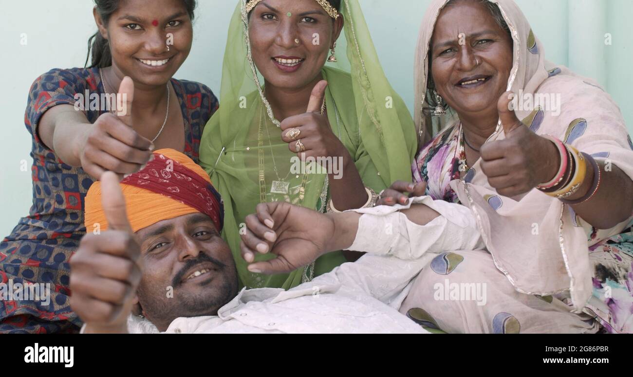 Group of cheerful Indian people posing with thumbs up Stock Photo - Alamy
