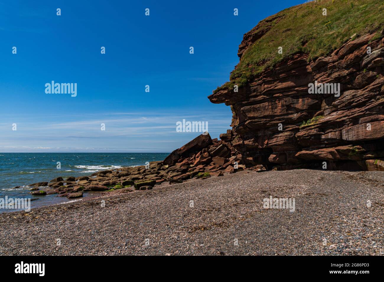 A picture showing a cliff face that is being eroded by the see at St ...