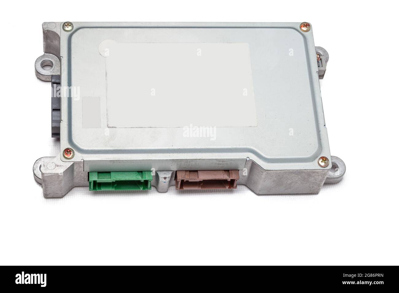 Metallic car engine control unit with plastic elements on a white ...