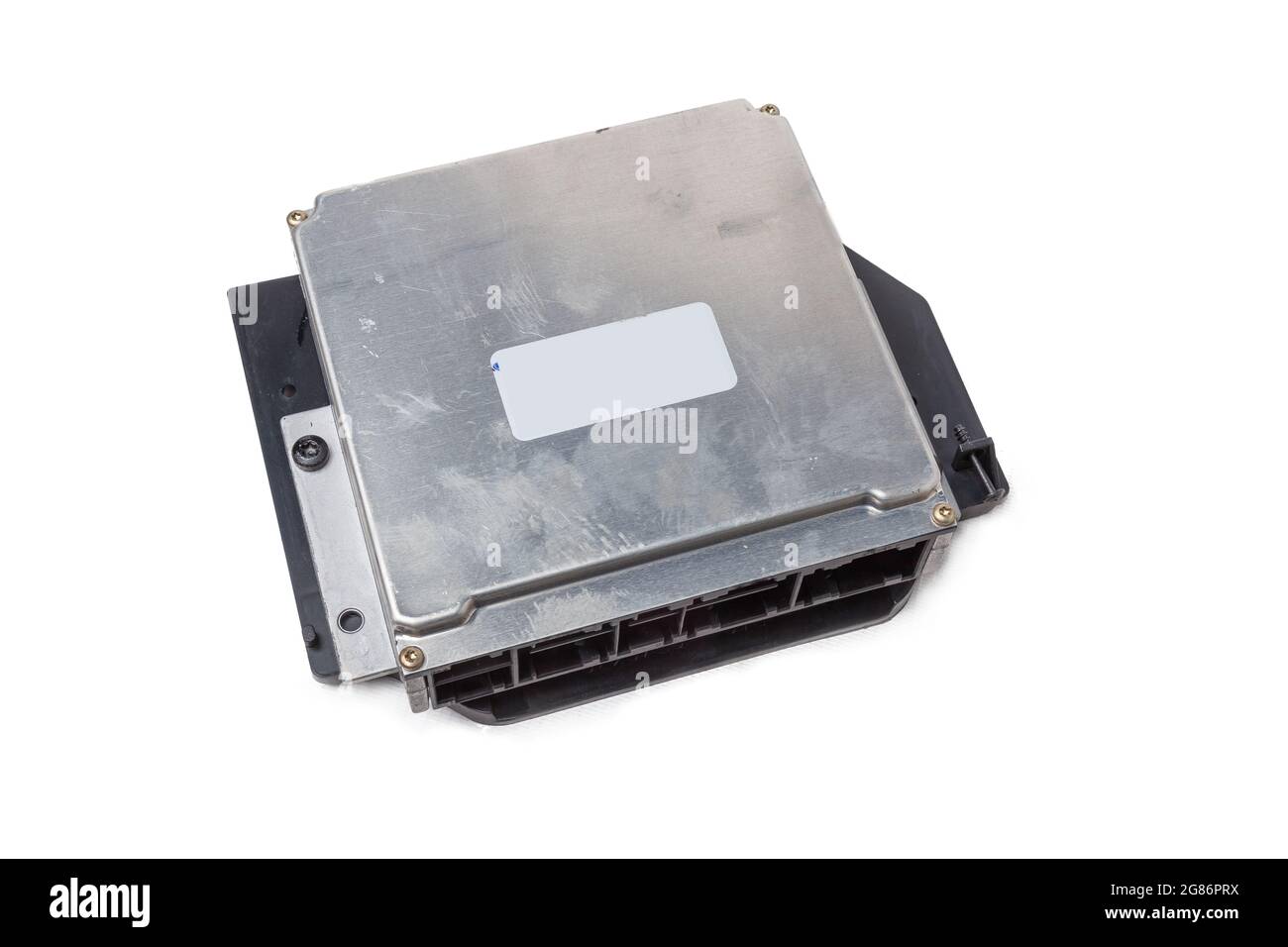 Metallic car engine control unit with plastic elements on a white ...