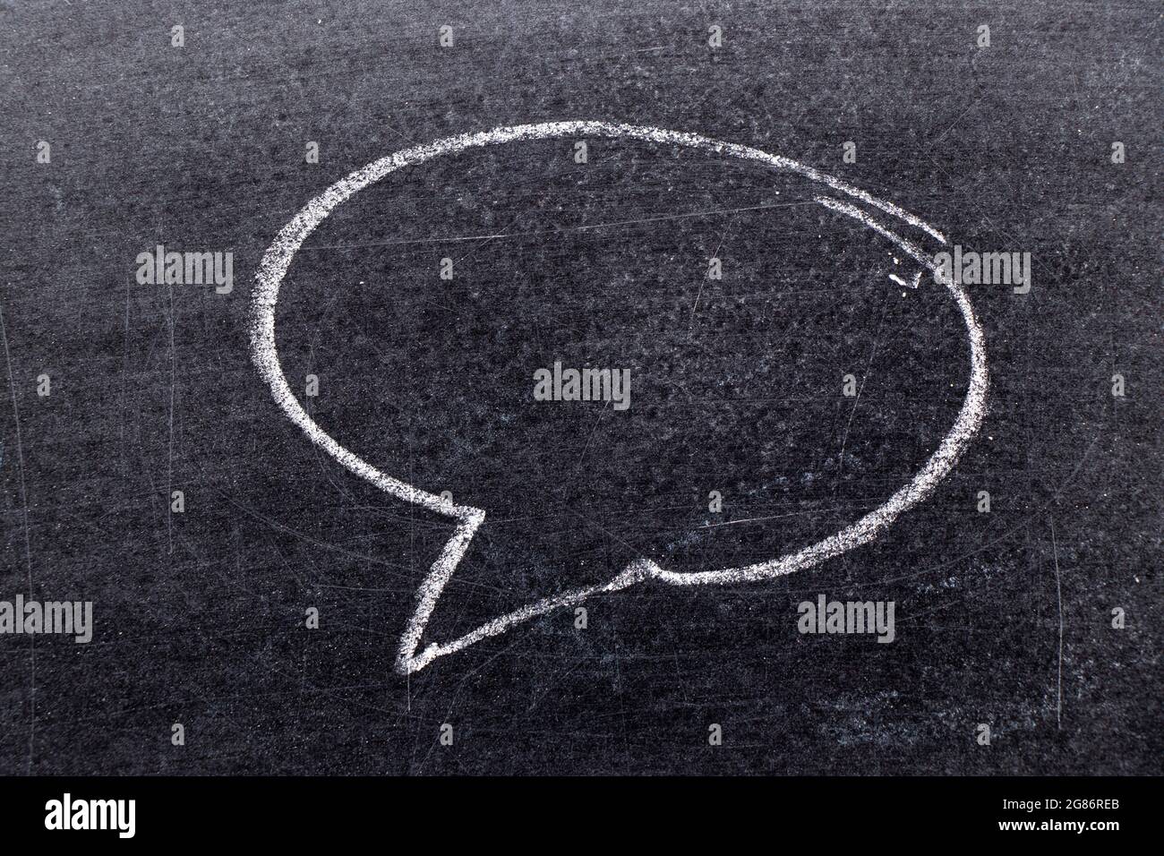 White chalk hand drawing in bubble speech shape with blank space for ...