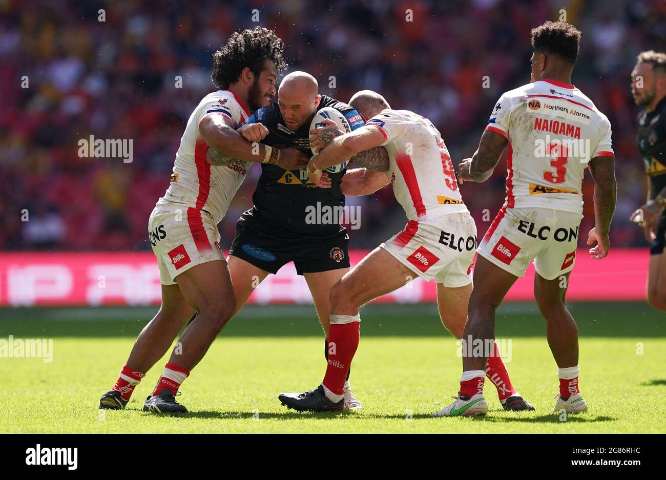 Castleford Tigers' Nathan Massey (centre) tackled by St Helens ...