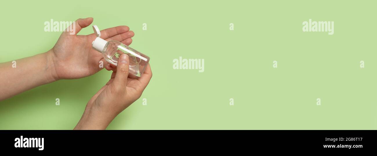 Applying a disinfectant alcohol gel to the palms of the hands to ...