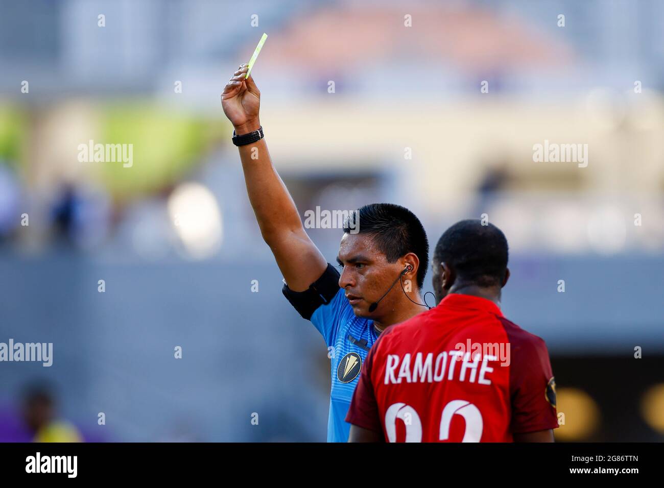 Orlando, Florida, USA. 16th July, 2021. Referee Bryan Lopez shows a ...