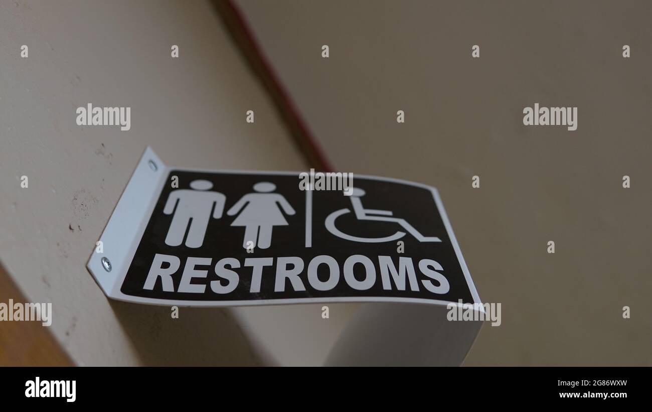 Low angle shot of a mixed gender restroom sign Stock Photo - Alamy