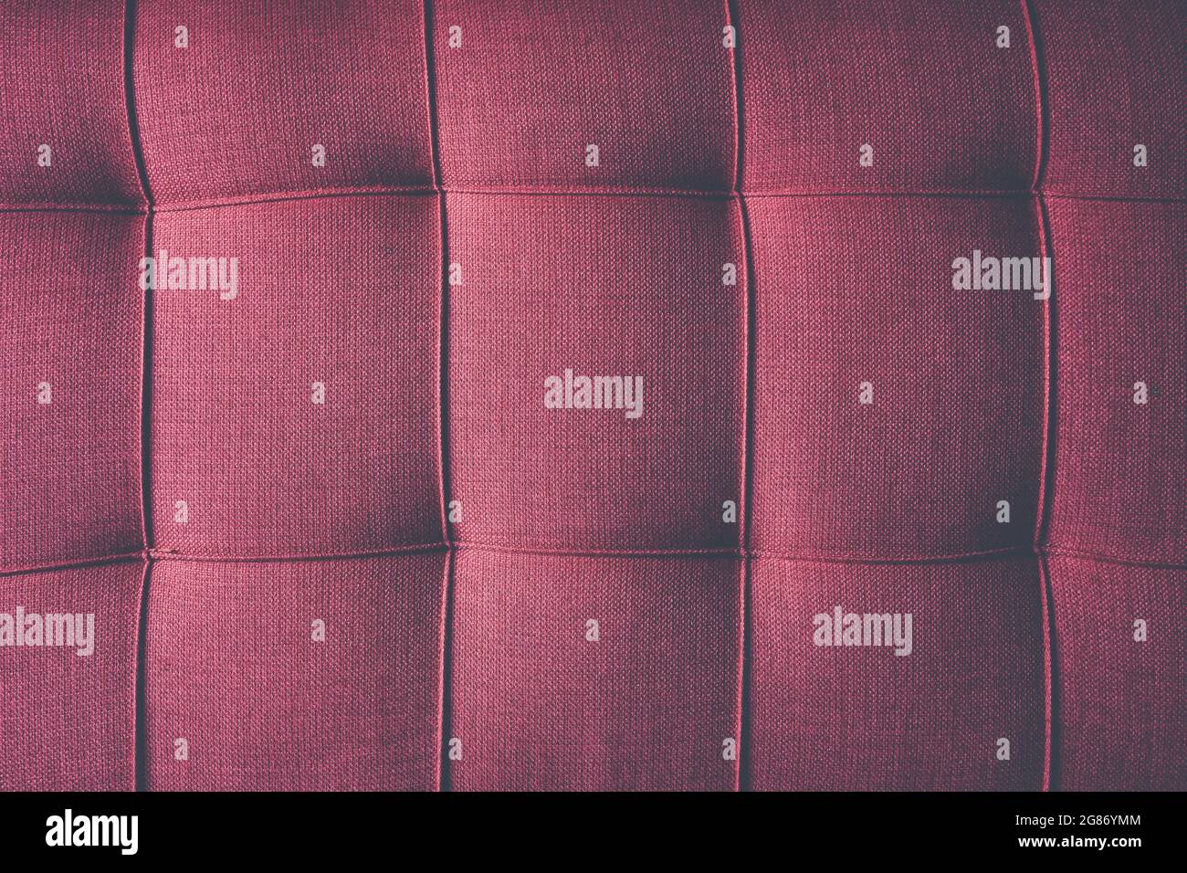 Texture details of red cover soft cotton cloth fine sewing sofa. Fabric ...