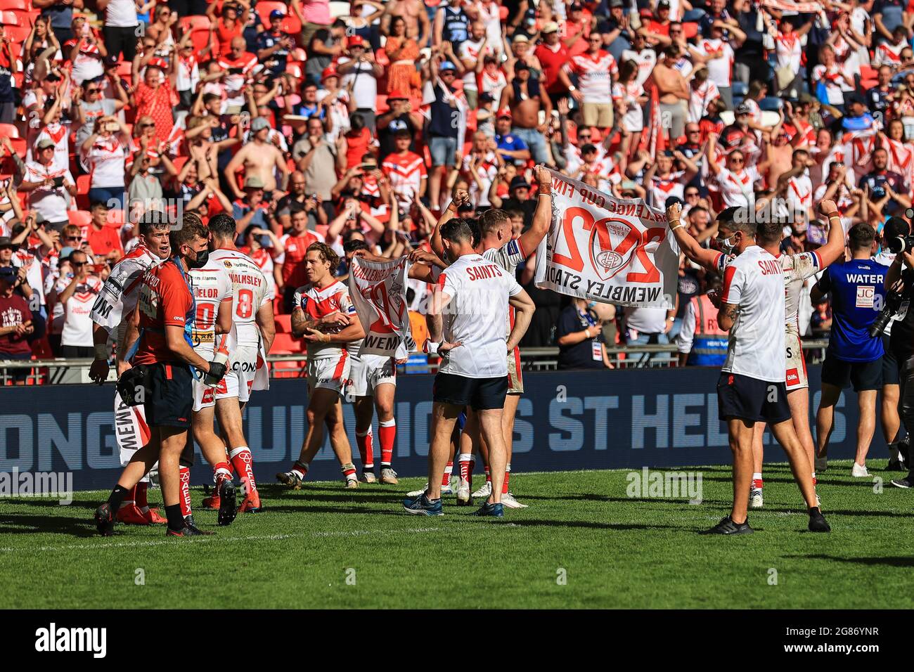 St Helens players celebrate with their fans at the end of the game in ...
