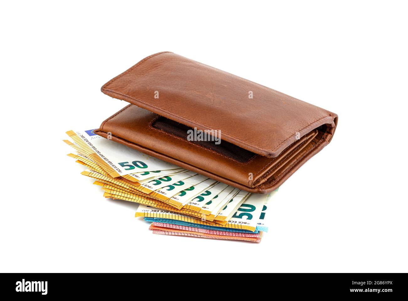 Mens brown leather wallet lying on a pile of Euro notes, isolated on a ...