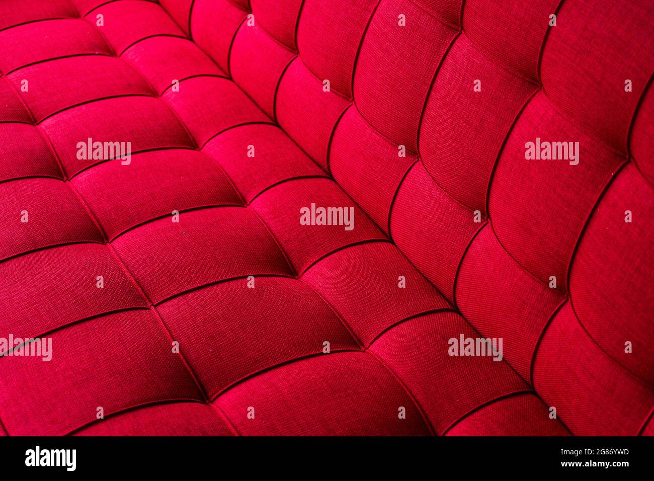 Texture details of red cover soft cotton cloth fine sewing sofa. Fabric ...